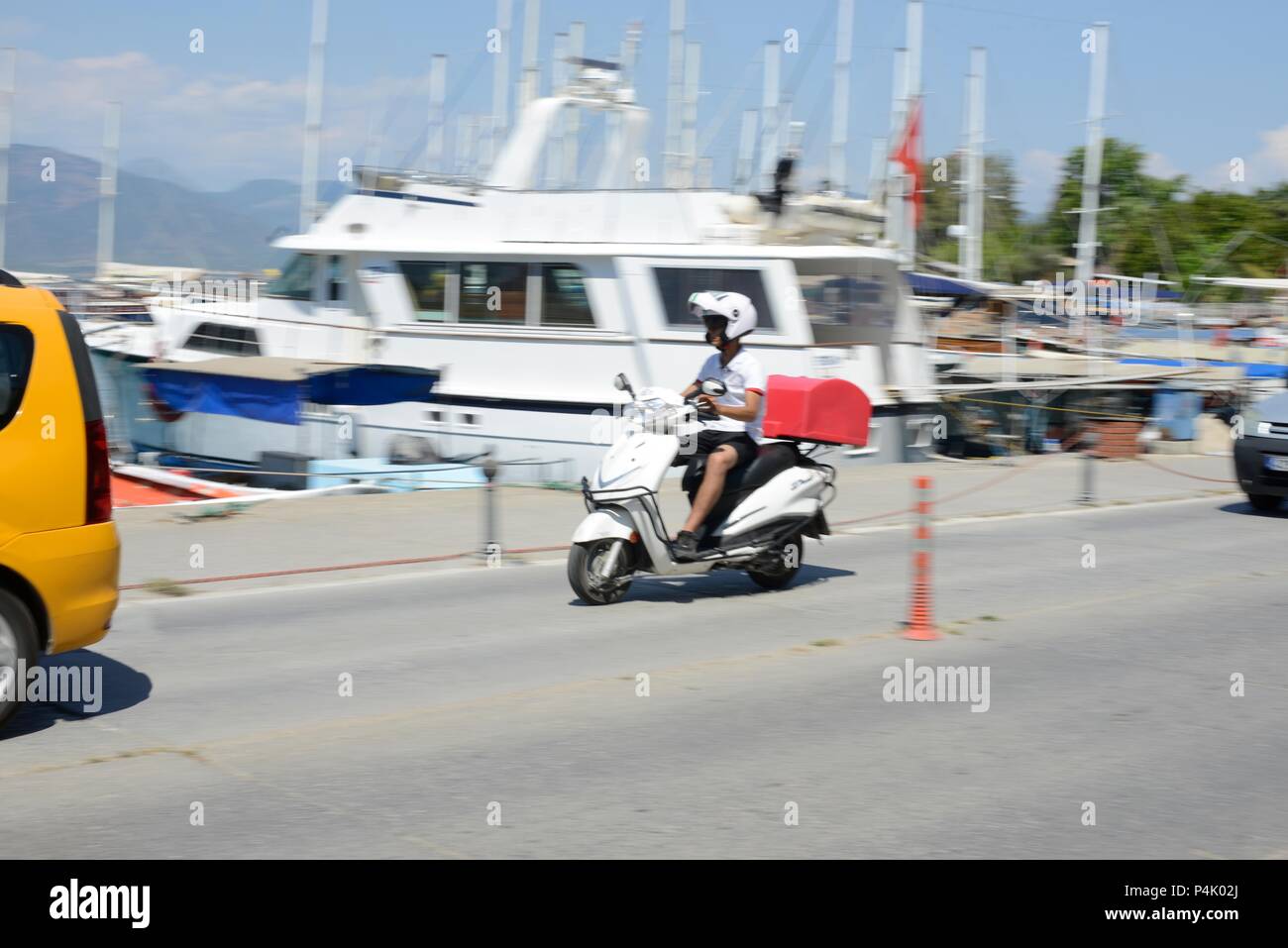 Speeding Scooters on Fetihye harbour Stock Photo - Alamy