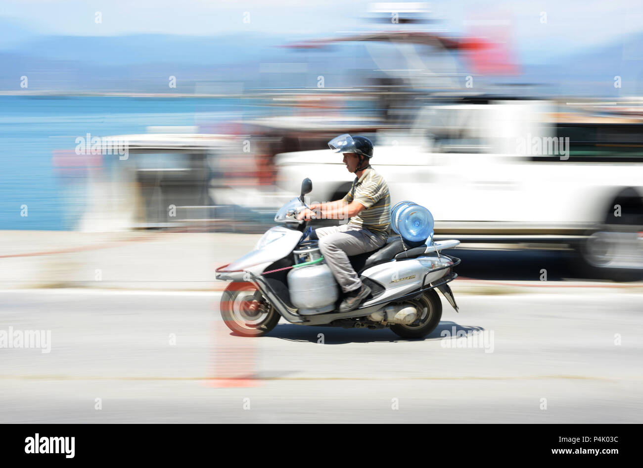 Speeding Scooters on Fetihye harbour Stock Photo - Alamy
