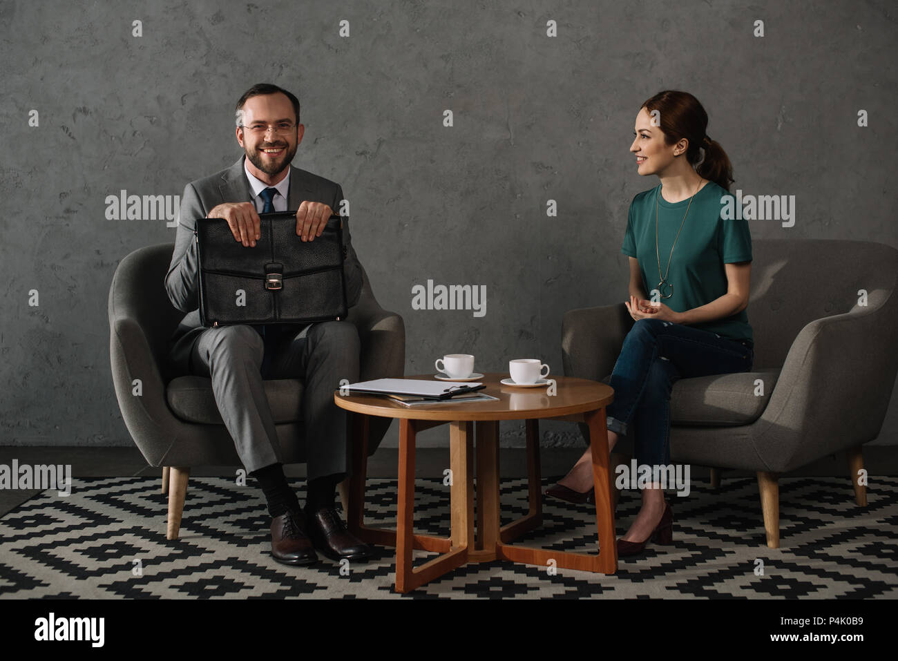 side view of smiling woman having meeting with lawyer Stock Photo - Alamy