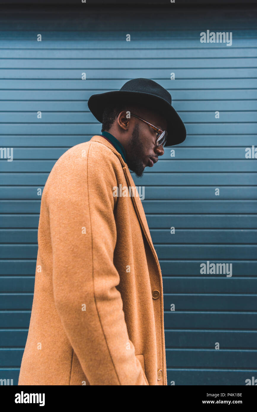 Man overcoat walking street hi-res stock photography and images - Alamy