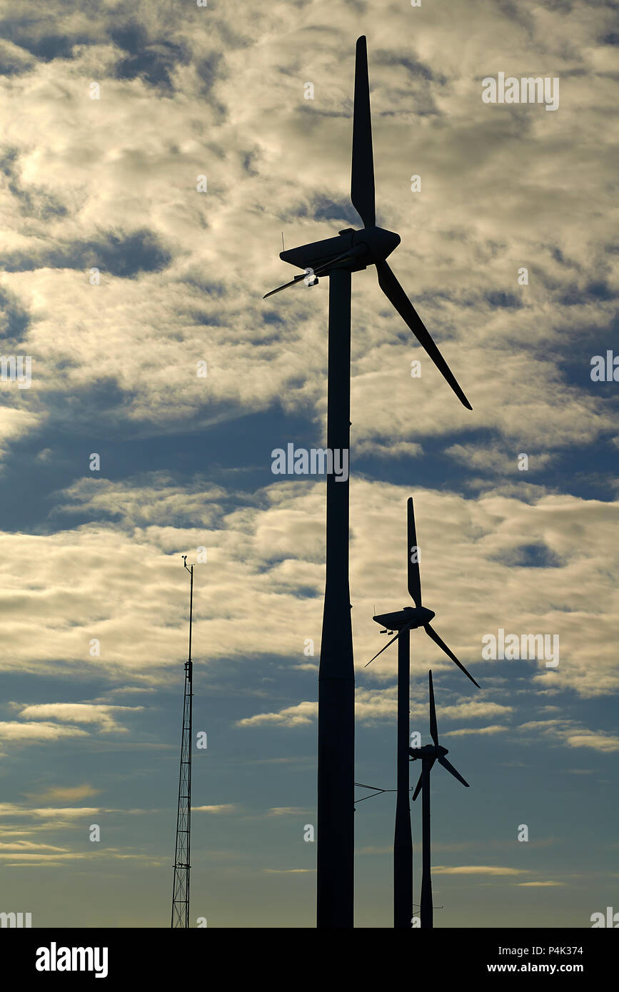 Dynamic low angle close up shot of a modern wind turbine park ...