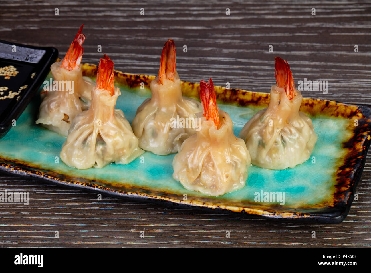 Delicious dim sum with shrimps and sauce Stock Photo - Alamy