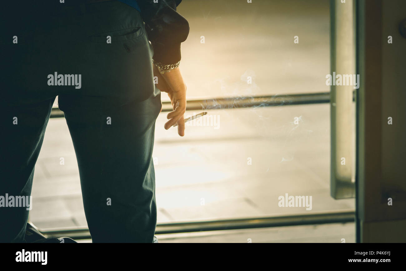 Closeup back view of Asian male with trousers and long sleeve shirt ...