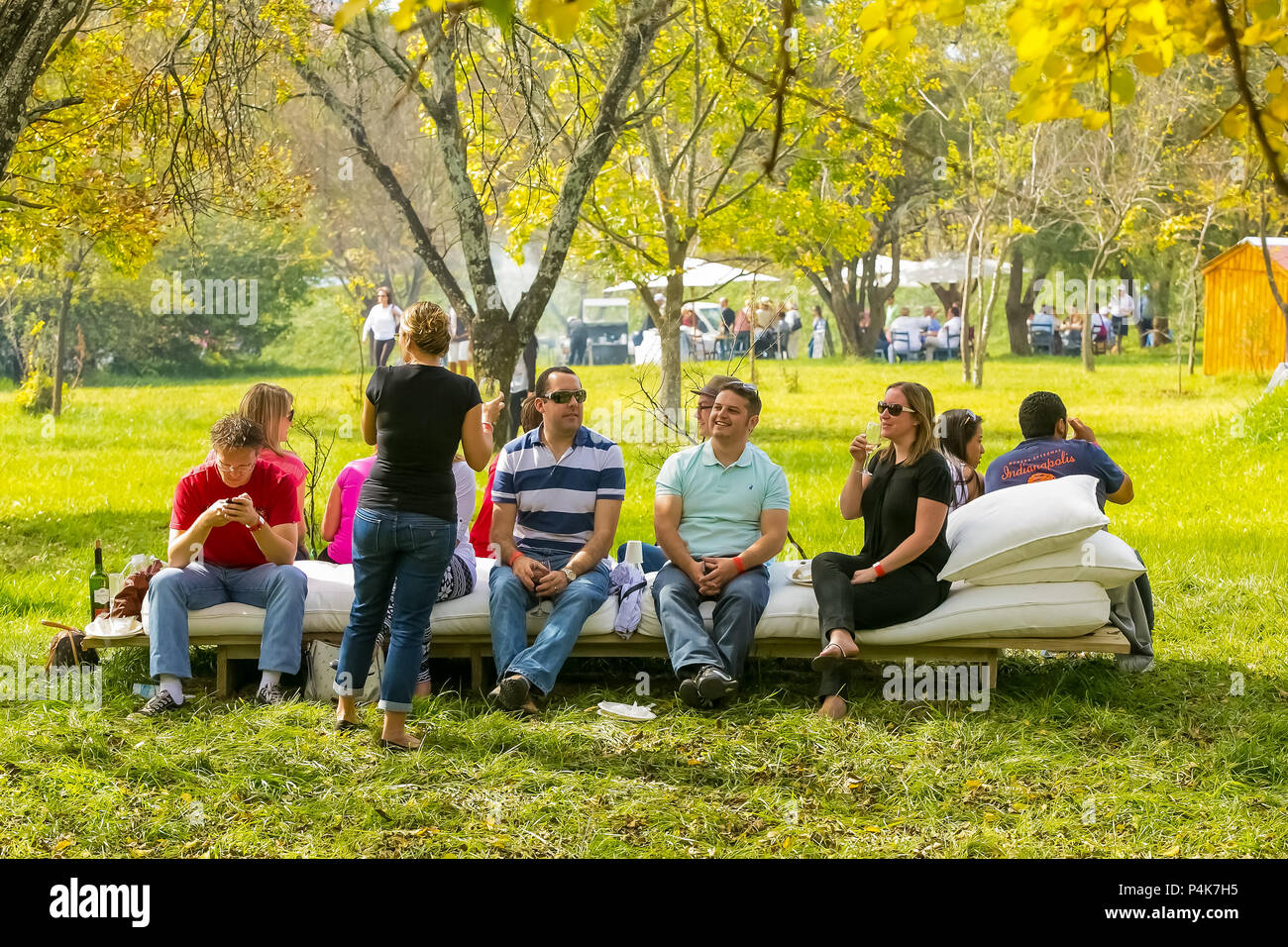 Group people sitting under tree africa hi-res stock photography and ...
