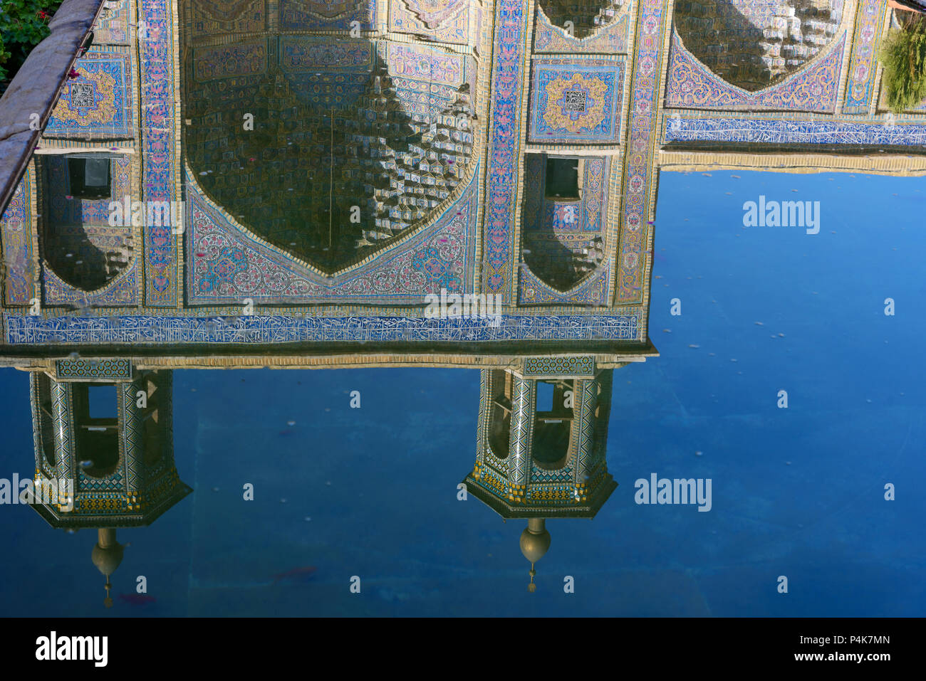 Reflection in pond in courtyard of Nasir Ol-Molk mosque, also famous as ...