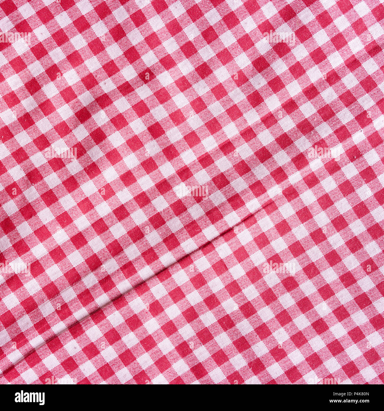 Red picnic tablecloth background. Red and white checkered fabric ...