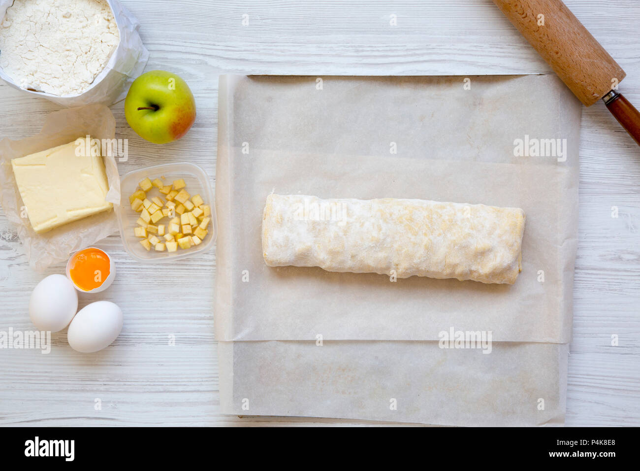 Raw apple pie or strudel with ingredients, top view. Flat lay. Copy ...