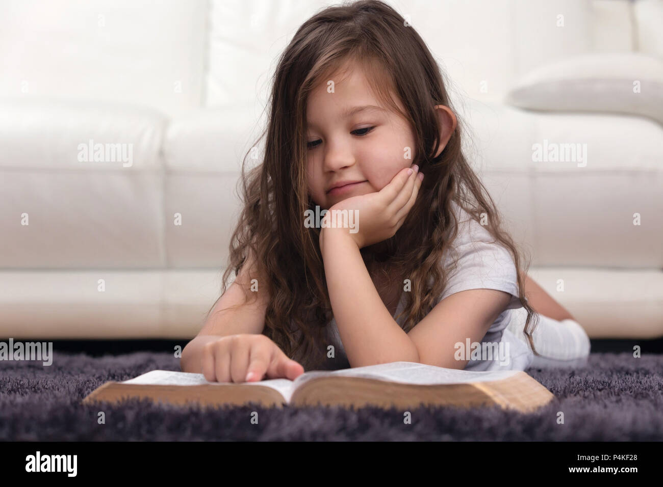 Child reading bible hi-res stock photography and images - Alamy