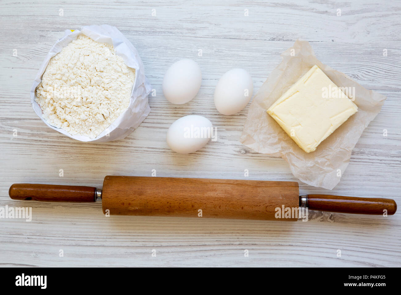 Ingredients for dough preparation on white wooden background. Flat lay ...