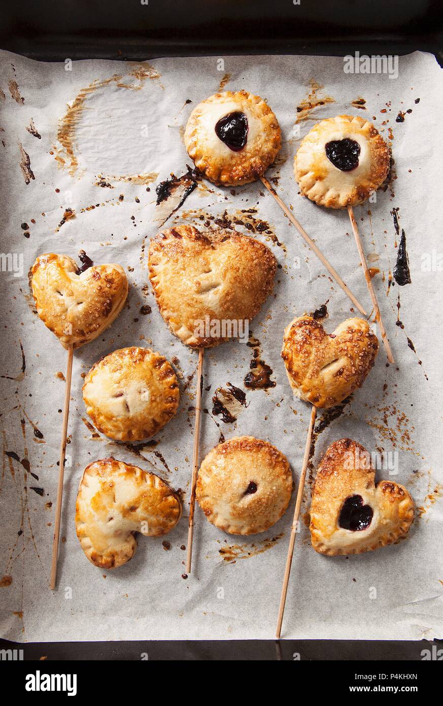 Cherry pie pops (small cherry pies on sticks Stock Photo - Alamy