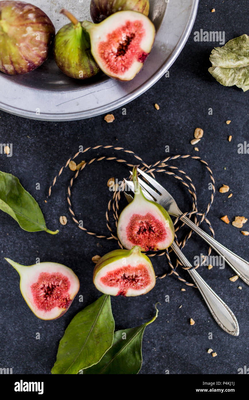 An arrangement of figs including halved figs Stock Photo - Alamy