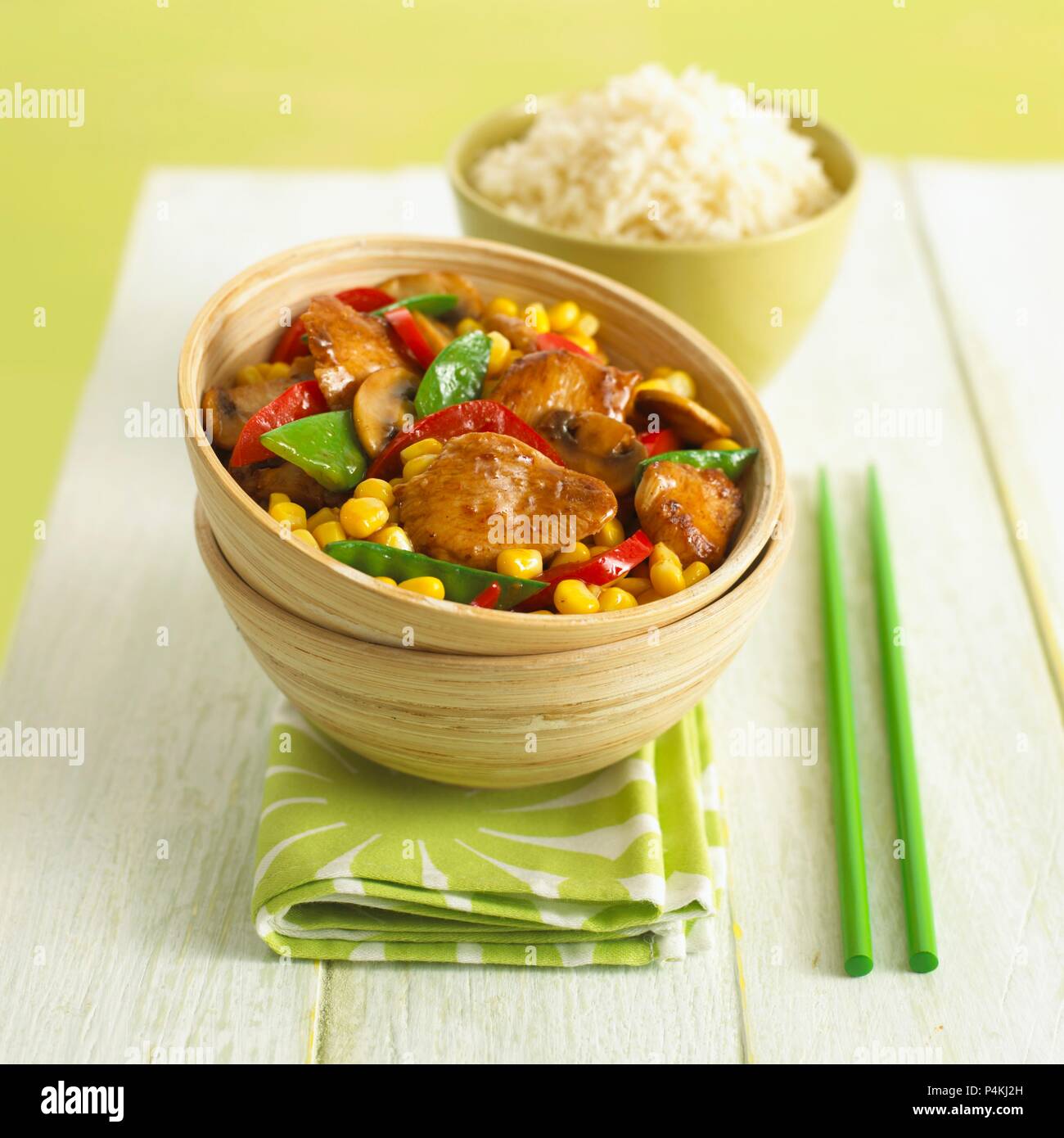 Chicken with sweetcorn, mange tout, mushrooms and peppers Stock Photo ...