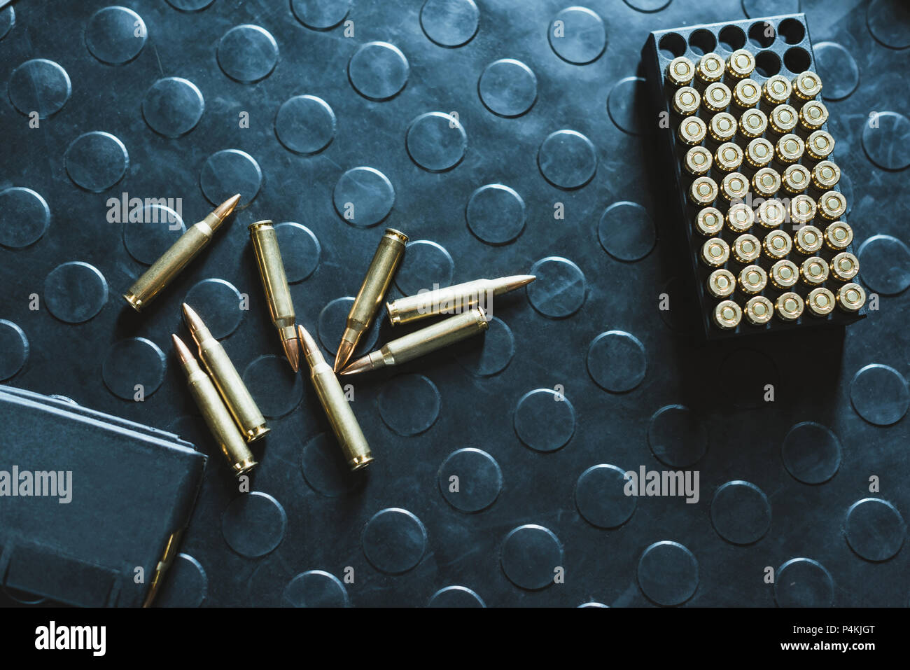 top view of rifle bullets and magazine on table Stock Photo - Alamy