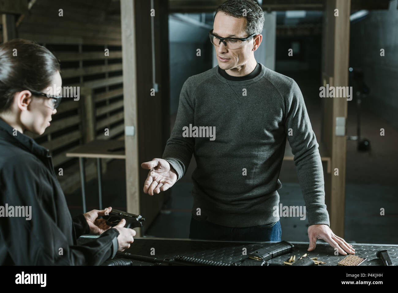 Female adult gun range hi-res stock photography and images - Alamy