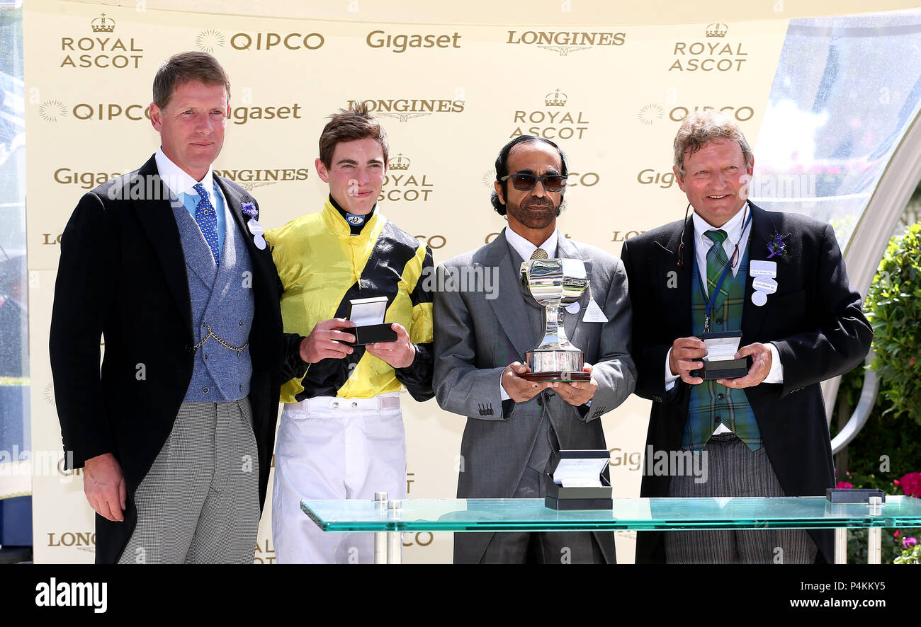 Jockey James Doyle, trainer Mark Johnston and owner Saif Ali with their ...