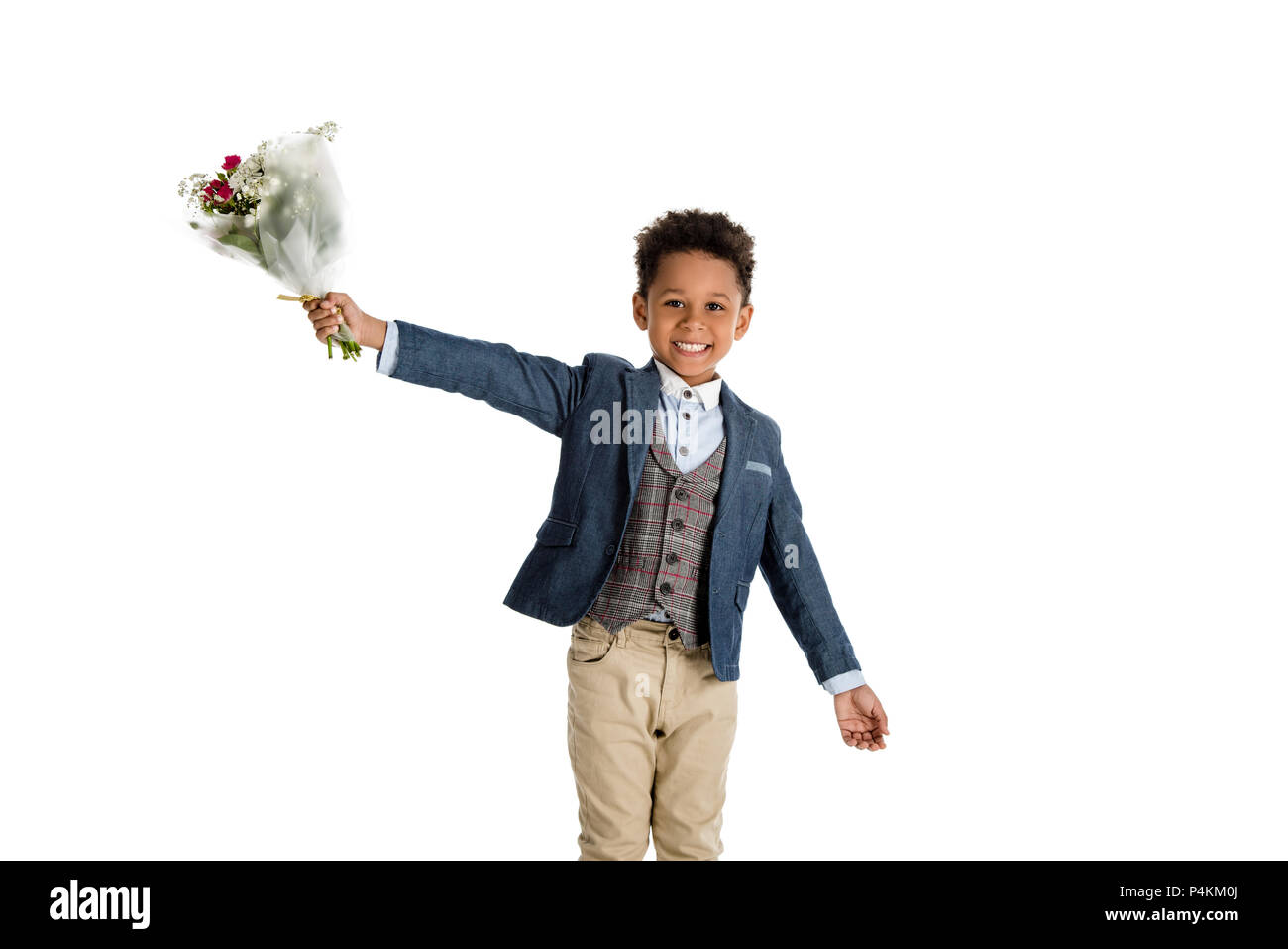 happy african american boy standing with bouquet isolated on white ...