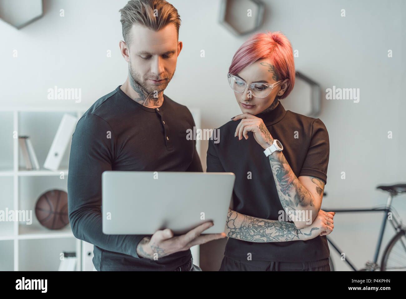 Tattoos in office work hi-res stock photography and images - Alamy