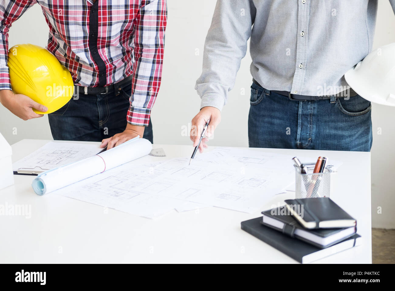 Close-up Of Person's engineer Hand Drawing Plan On Blue Print with ...