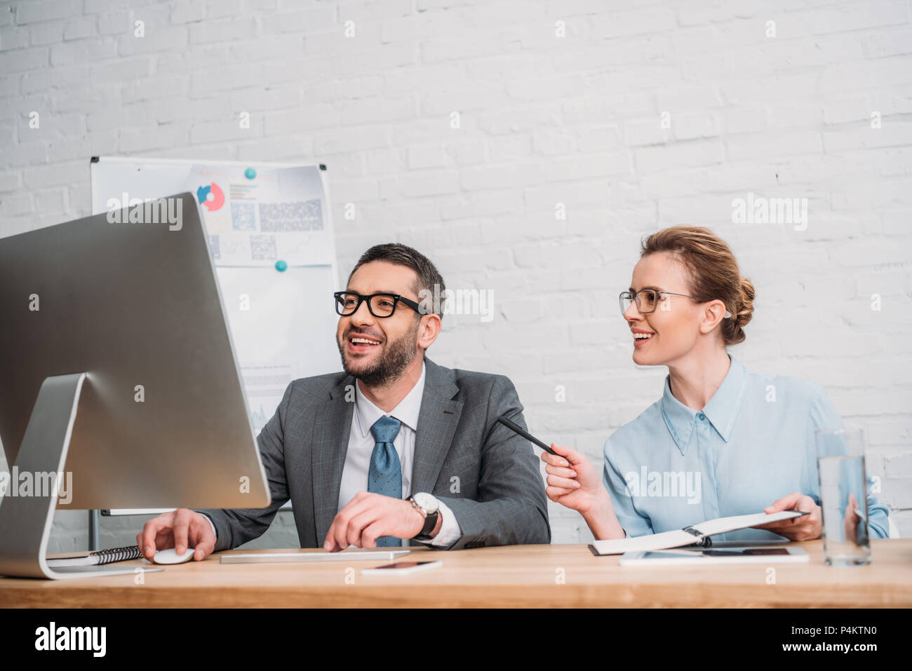Male colleagues laughing computer hi-res stock photography and images ...