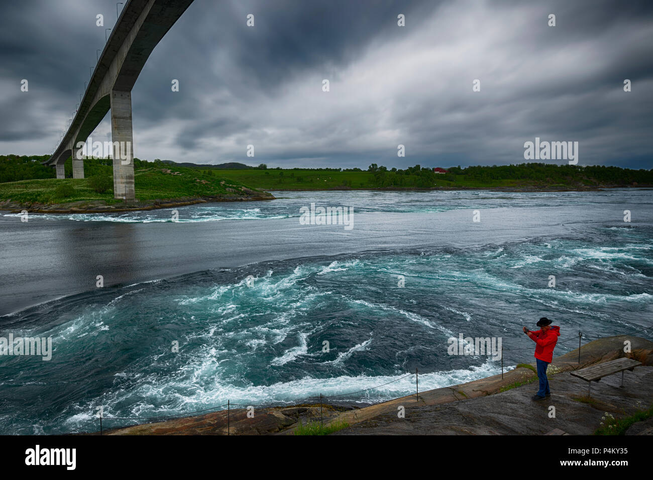 A lone figure observes the Saltstraumen, Bodo, Norway Stock Photo - Alamy