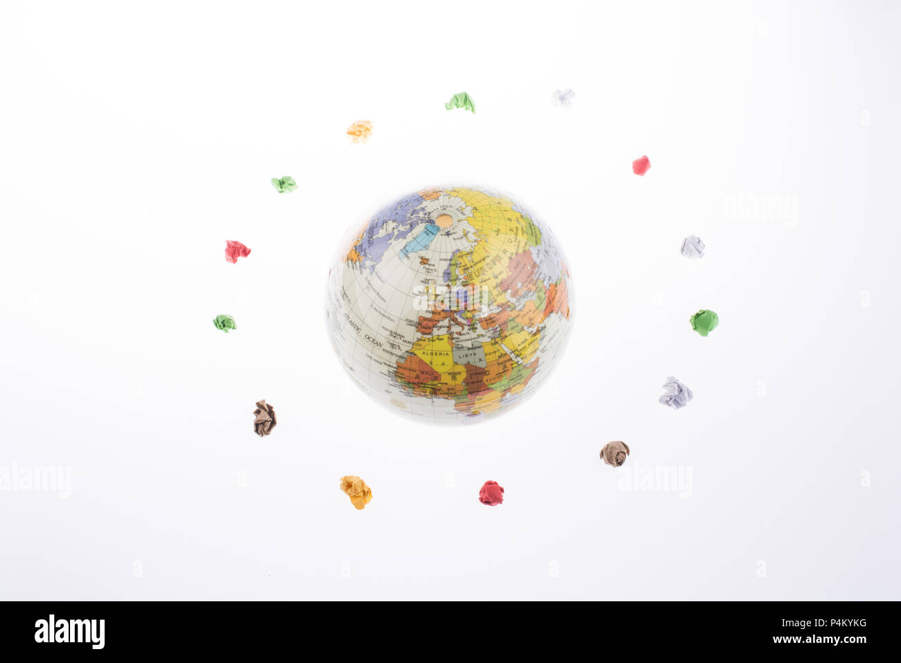 globe orbit and crumpled papers on a white background Stock Photo - Alamy