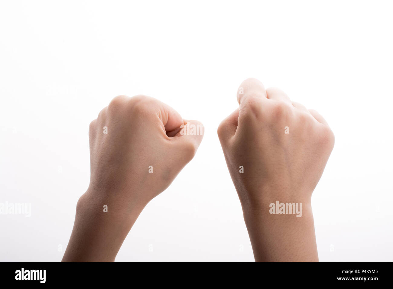 Clenched fists on a white background Stock Photo - Alamy