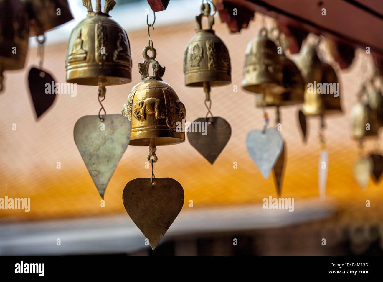 Row of golden bells in buddhist temple Stock Photo - Alamy