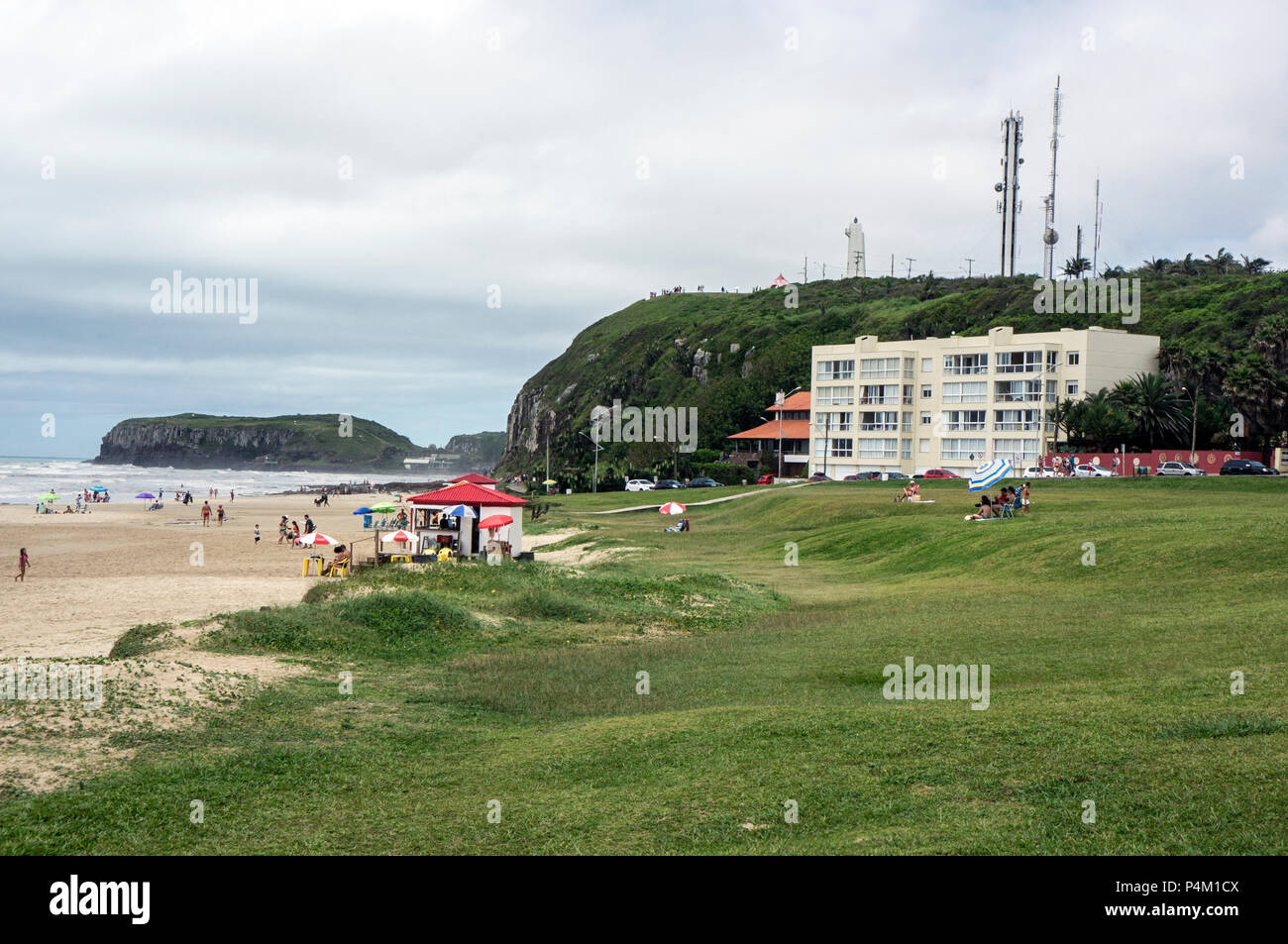 beach city Torres Brazil sand grass rock cliff mountain antenas Stock ...