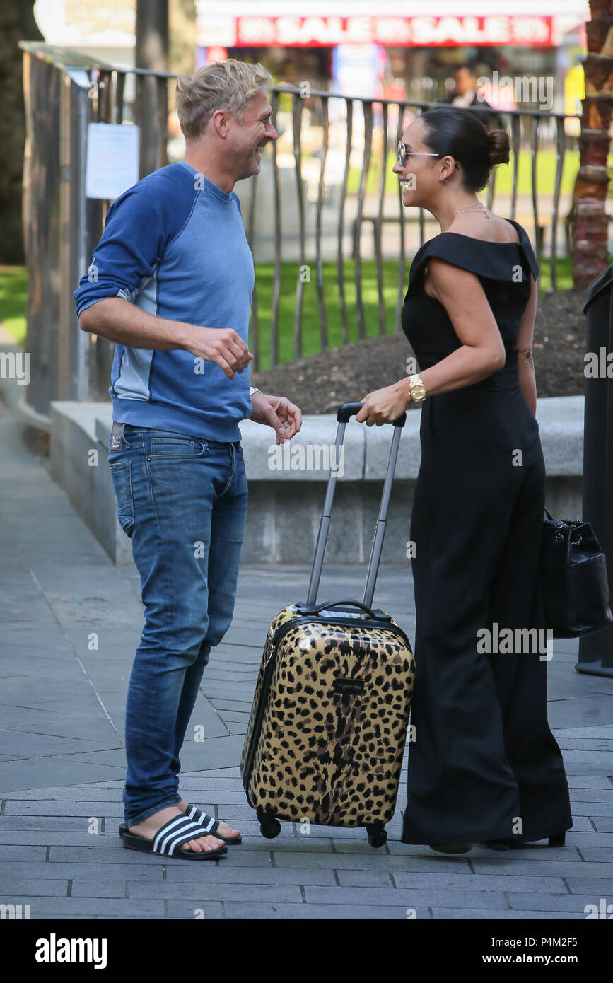 Myleene Klass gets a kiss from her boyfriend Simon Motson as she ...