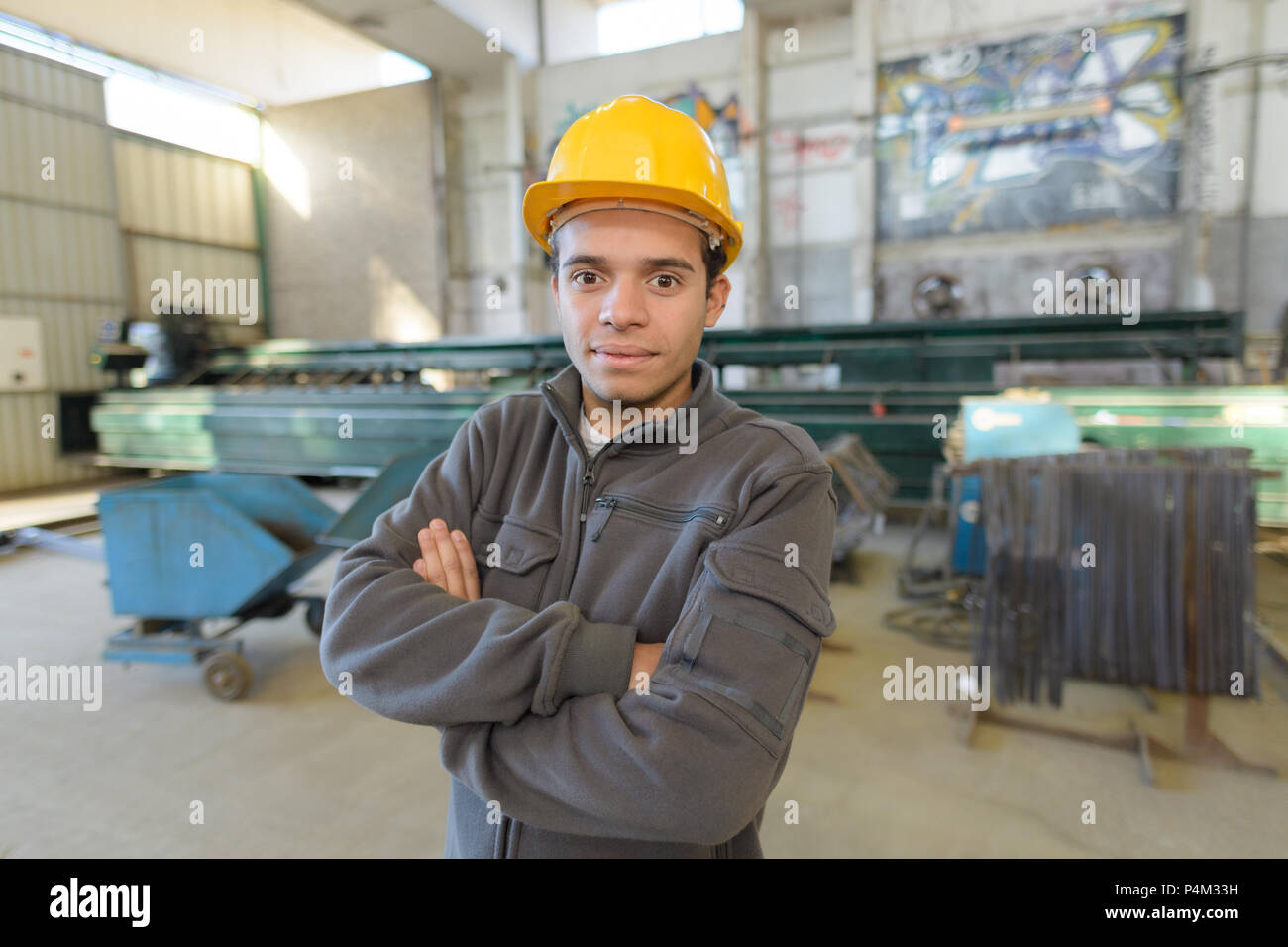 young man in factory Stock Photo - Alamy