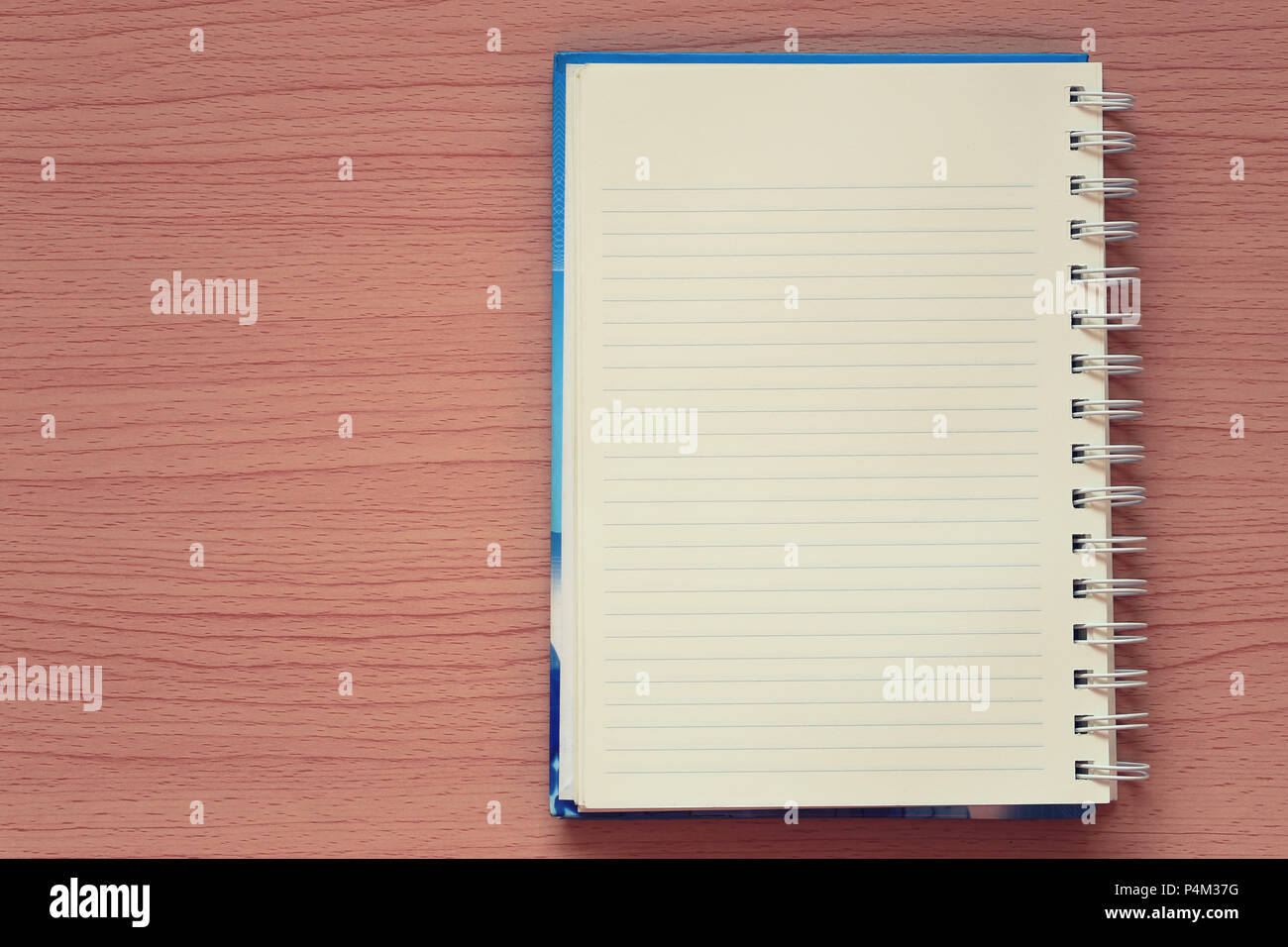 Empty book is placed on a brown wooden background and have copy space ...