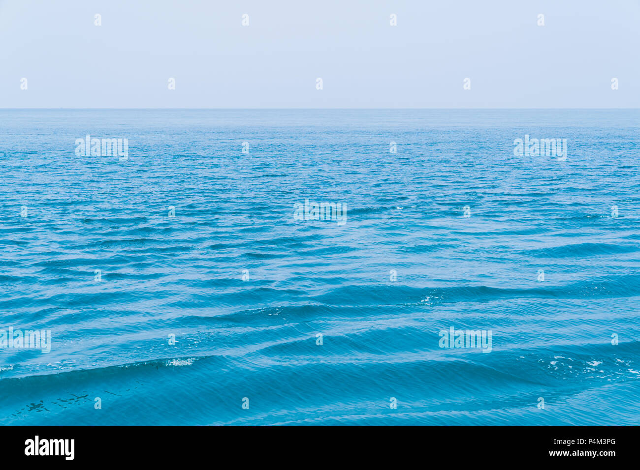 Beautiful smooth ocean water and blue sky background, landscape sea and ...