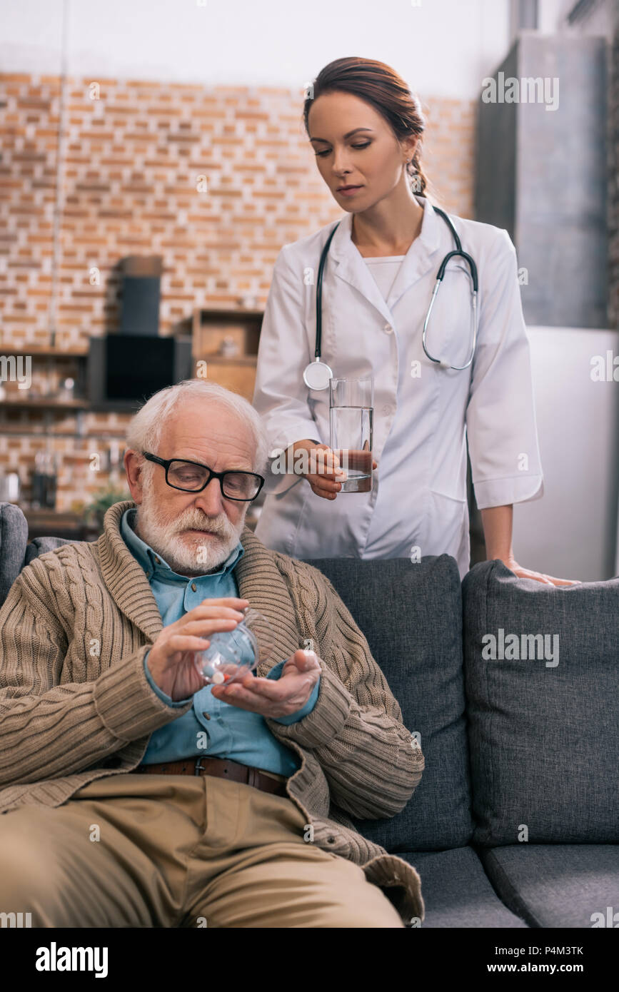 Doctor giving water elderly hi-res stock photography and images - Alamy