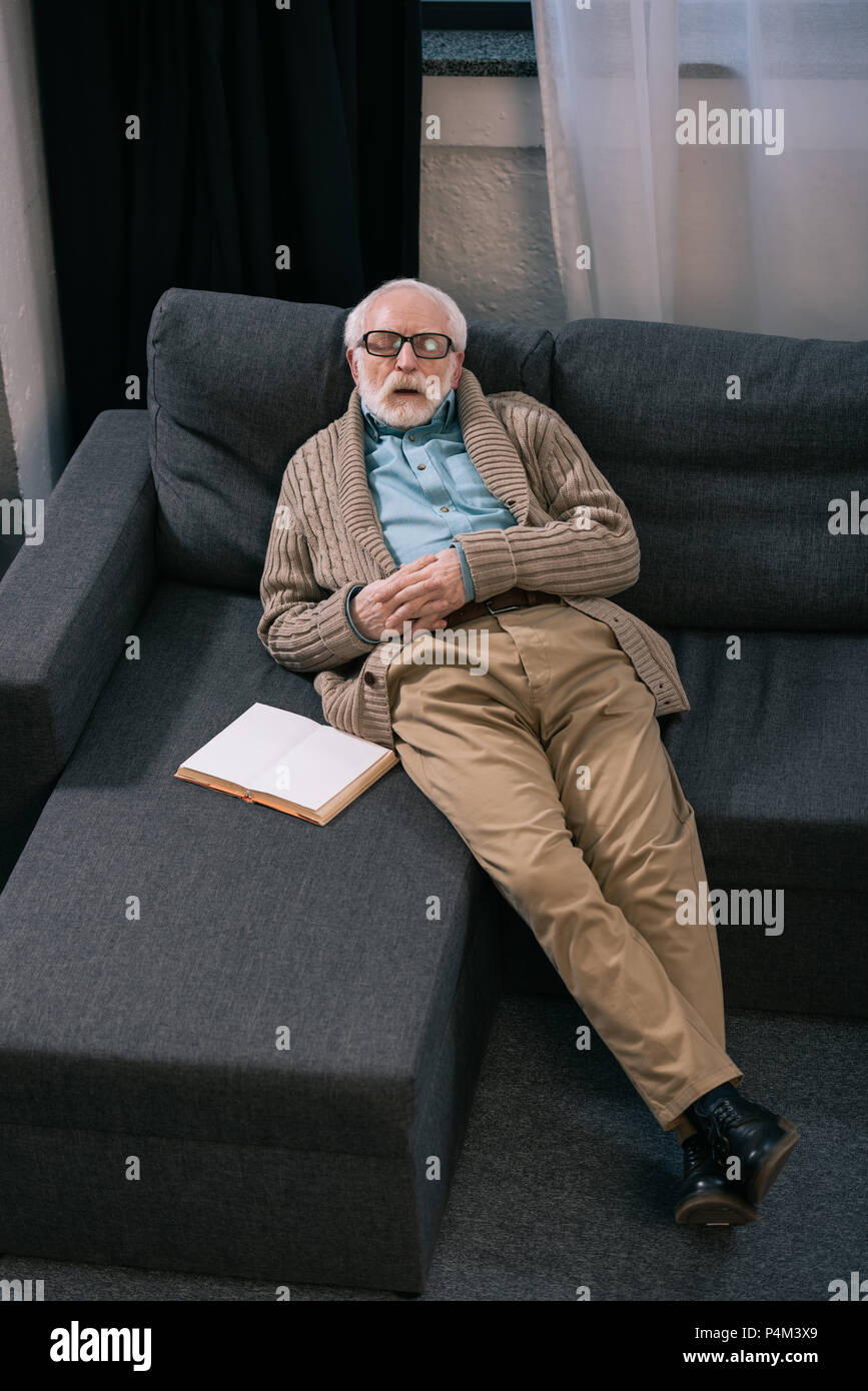 Man sleeping on sofa hi-res stock photography and images - Alamy