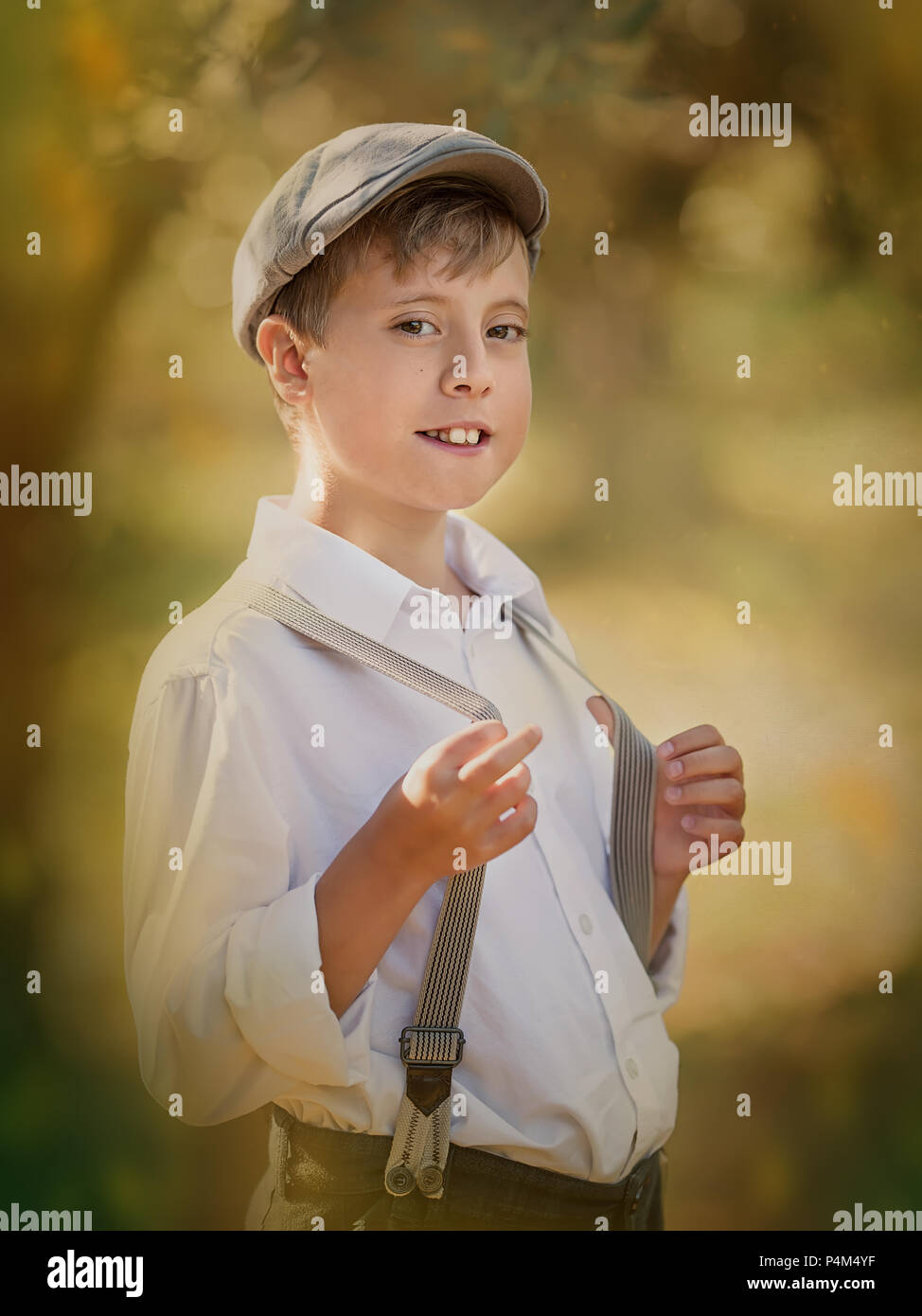 Portrait of a beautiful boy on a nature background Stock Photo - Alamy