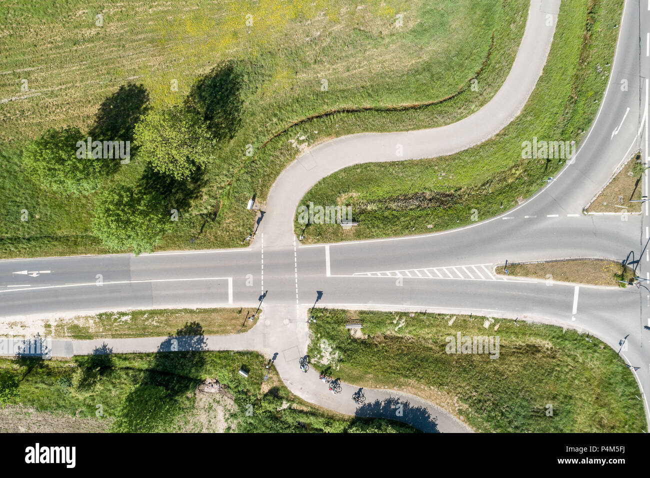 Aerial photo of a cycle path in Germany crossing a road for cars ...