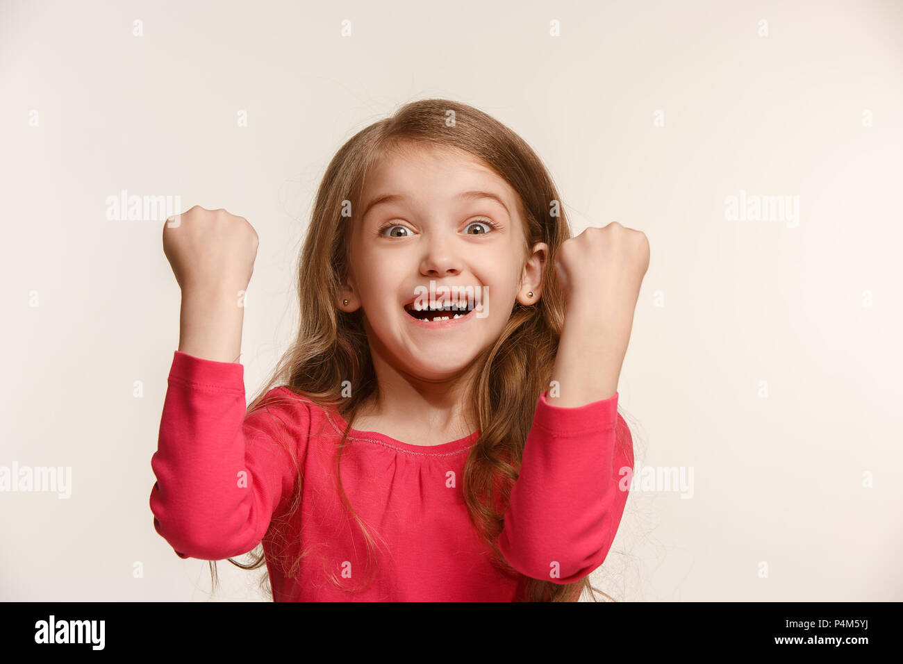 Happy success teen girl celebrating being a winner. Dynamic energetic ...