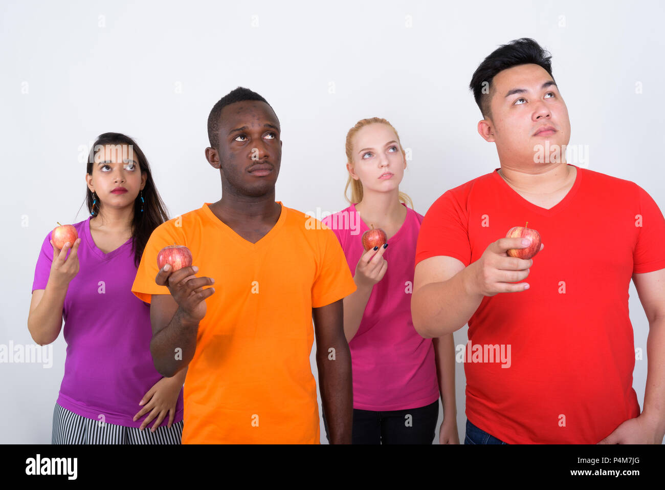 Studio shot of diverse group of multi ethnic friends thinking wh Stock ...