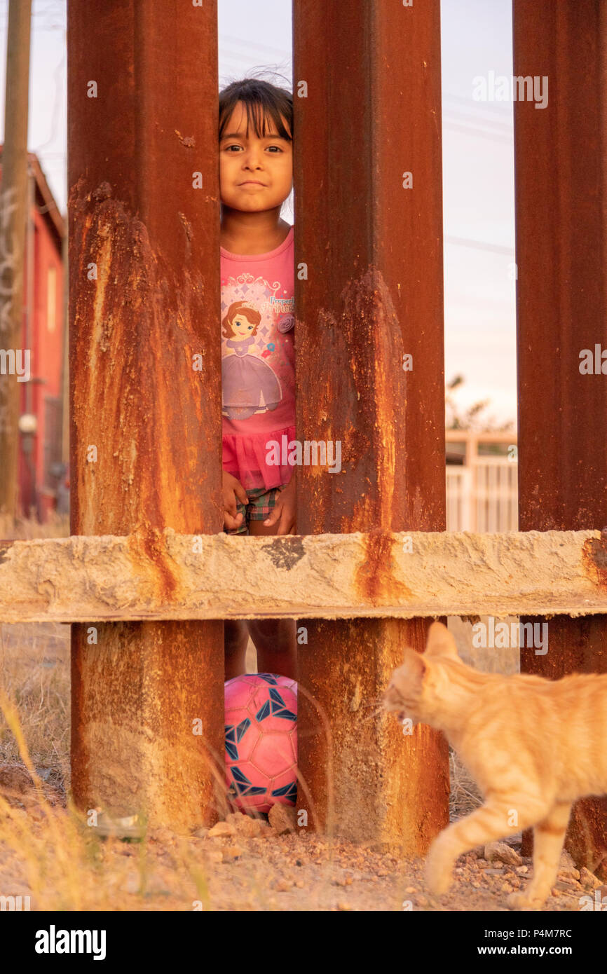 Children play on the Mexican side of the US Mexican border wall, Trump ...