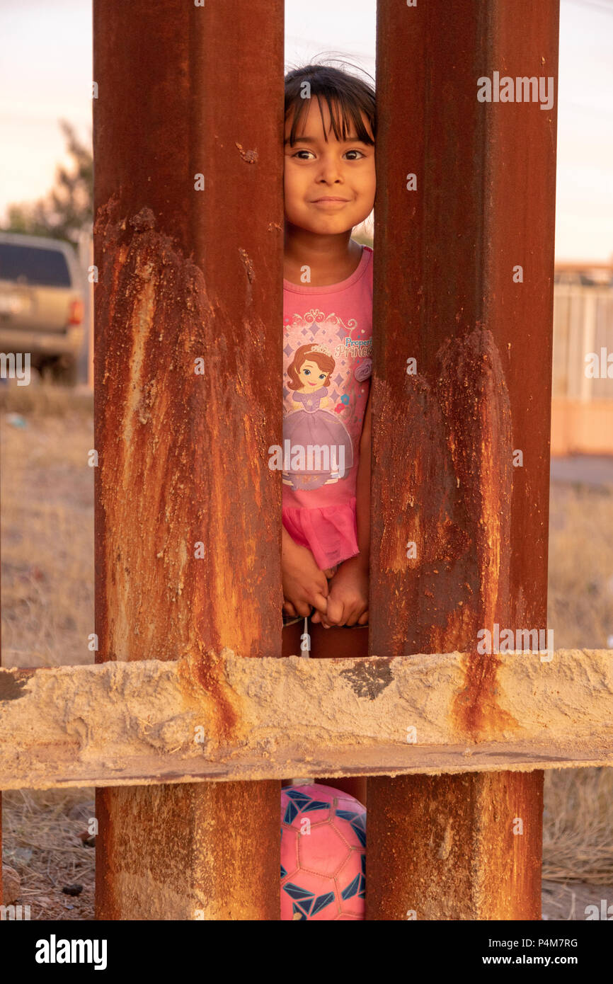 Children play on the Mexican side of the US Mexican border wall, Trump ...