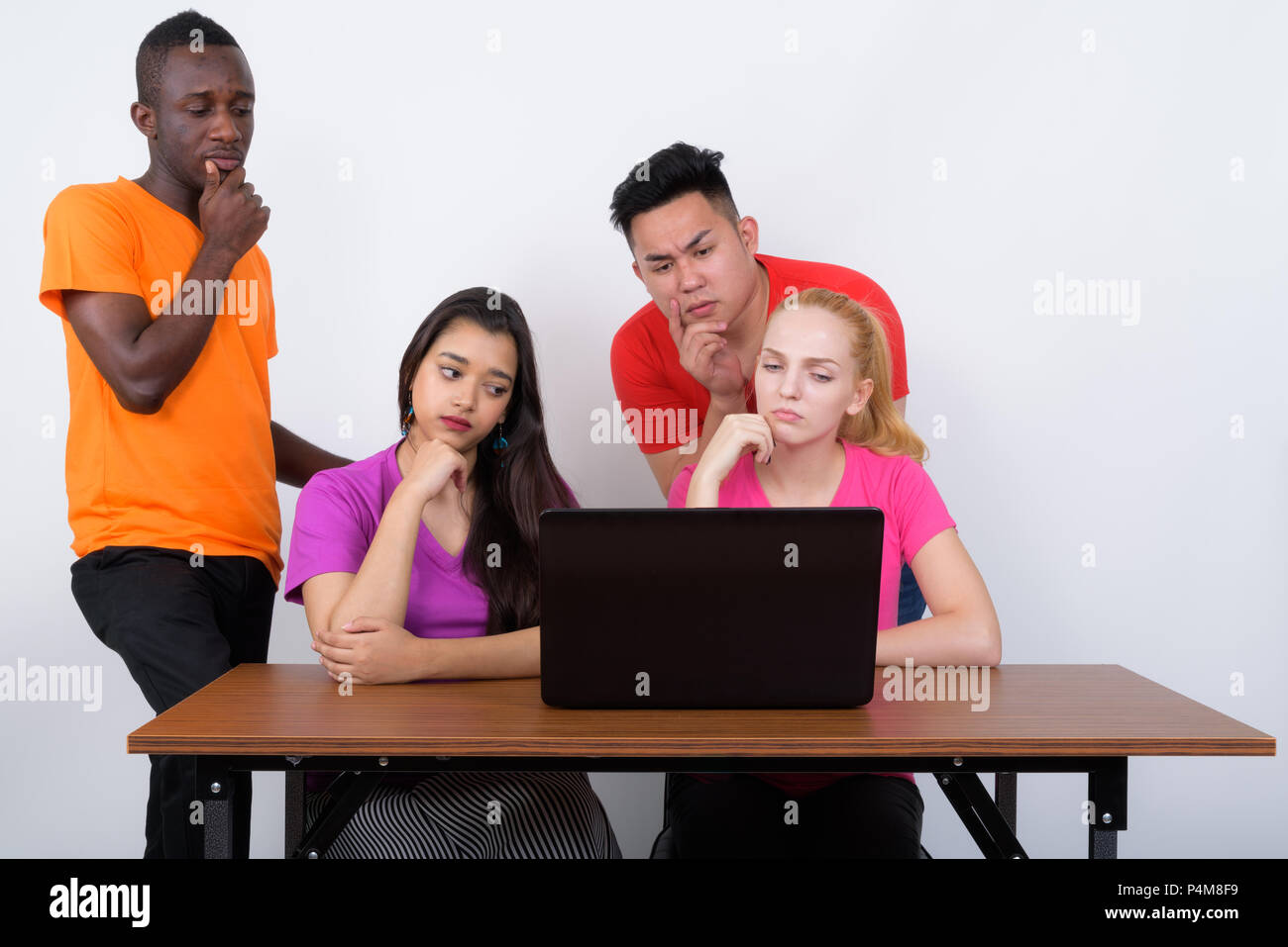 Studio shot of diverse group of multi ethnic friends thinking wh Stock ...