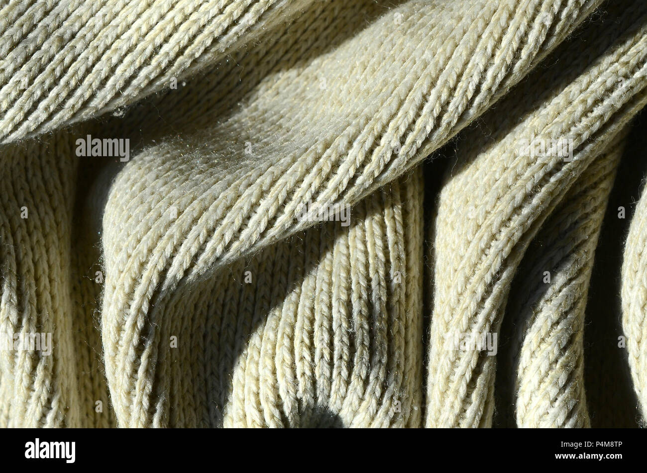 Fabric texture of a soft yellow knitted sweater. Macro image of the ...