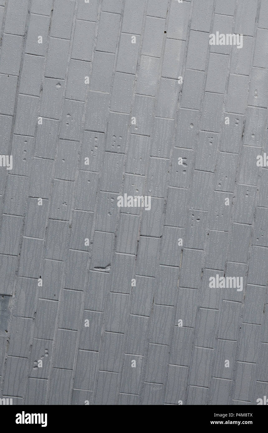The texture of the wall from the old tile, painted gray under the ...