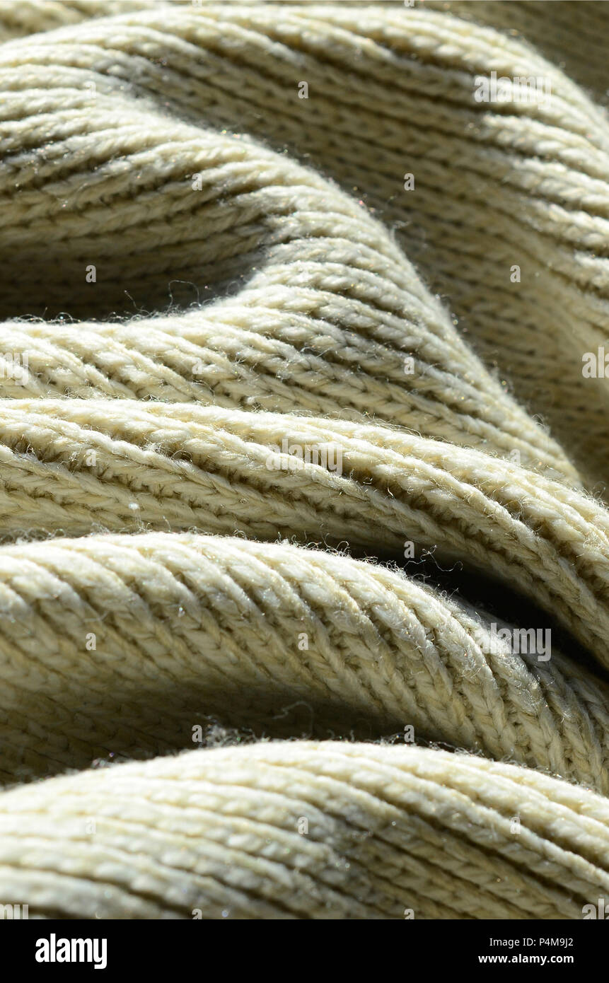 Fabric texture of a soft yellow knitted sweater. Macro image of the ...