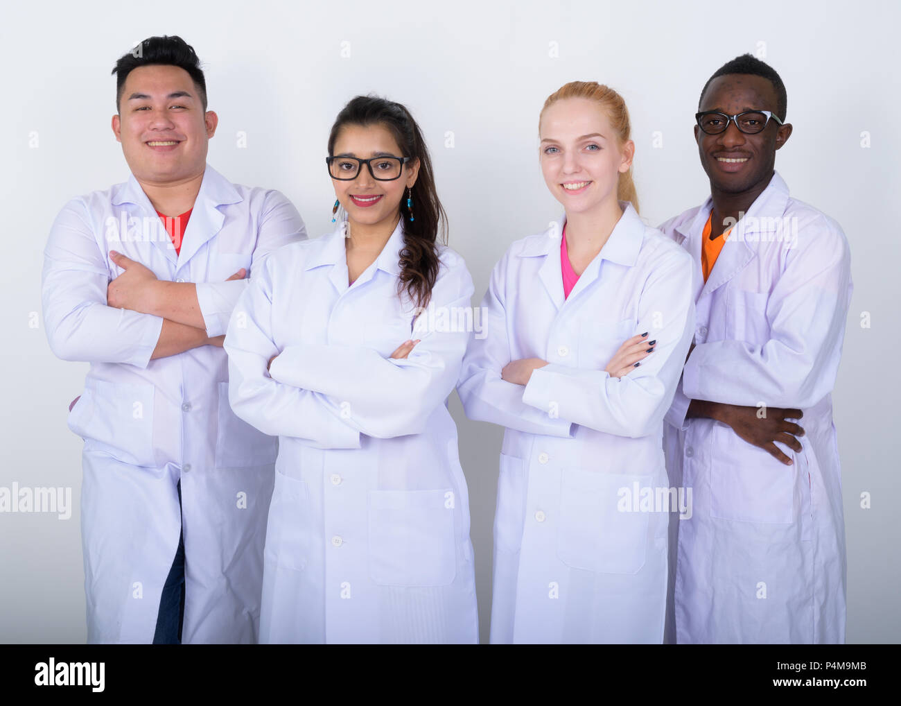 Studio shot of happy diverse group of multi ethnic doctors smili Stock ...