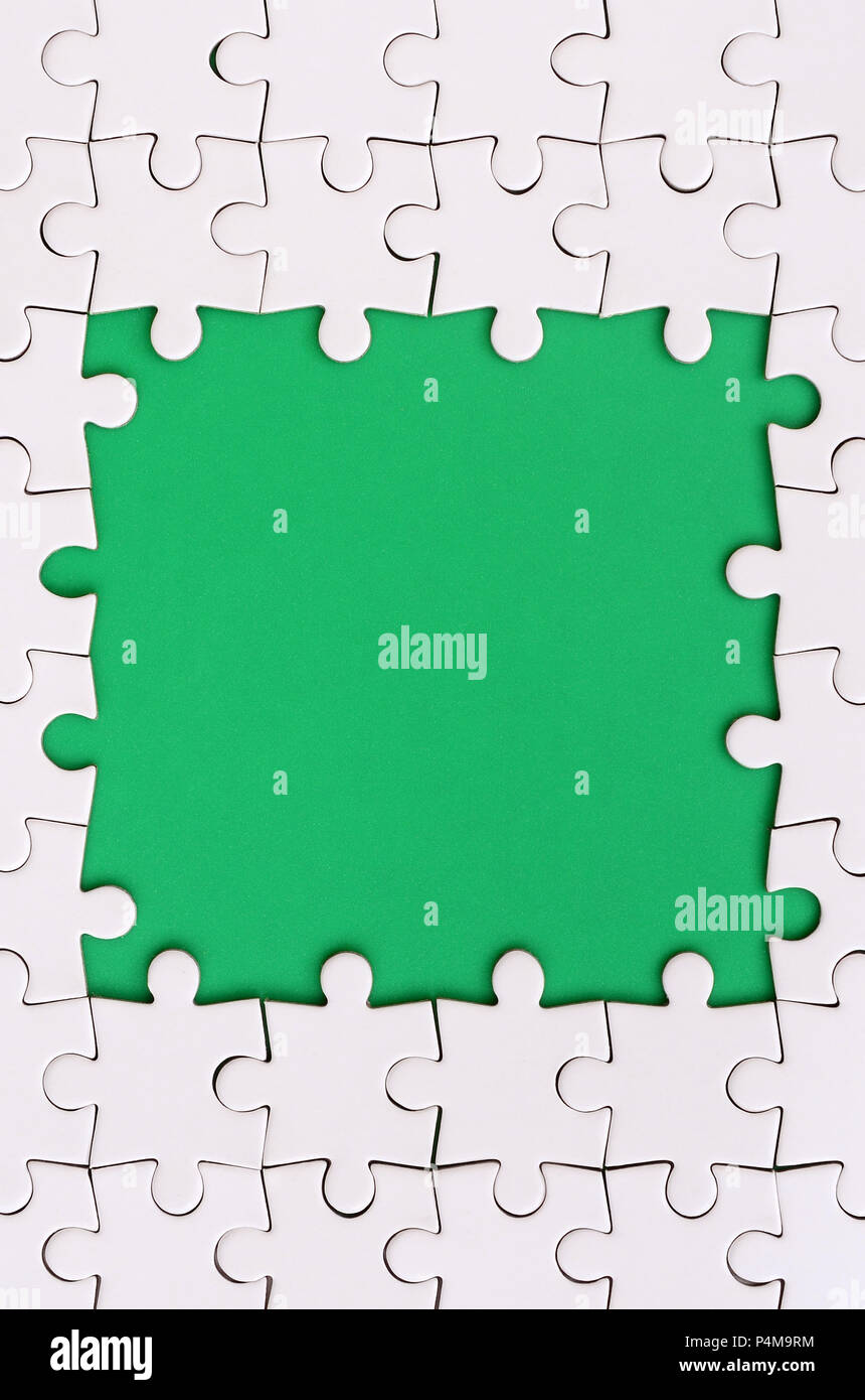 Framing in the form of a rectangle, made of a white jigsaw puzzle ...