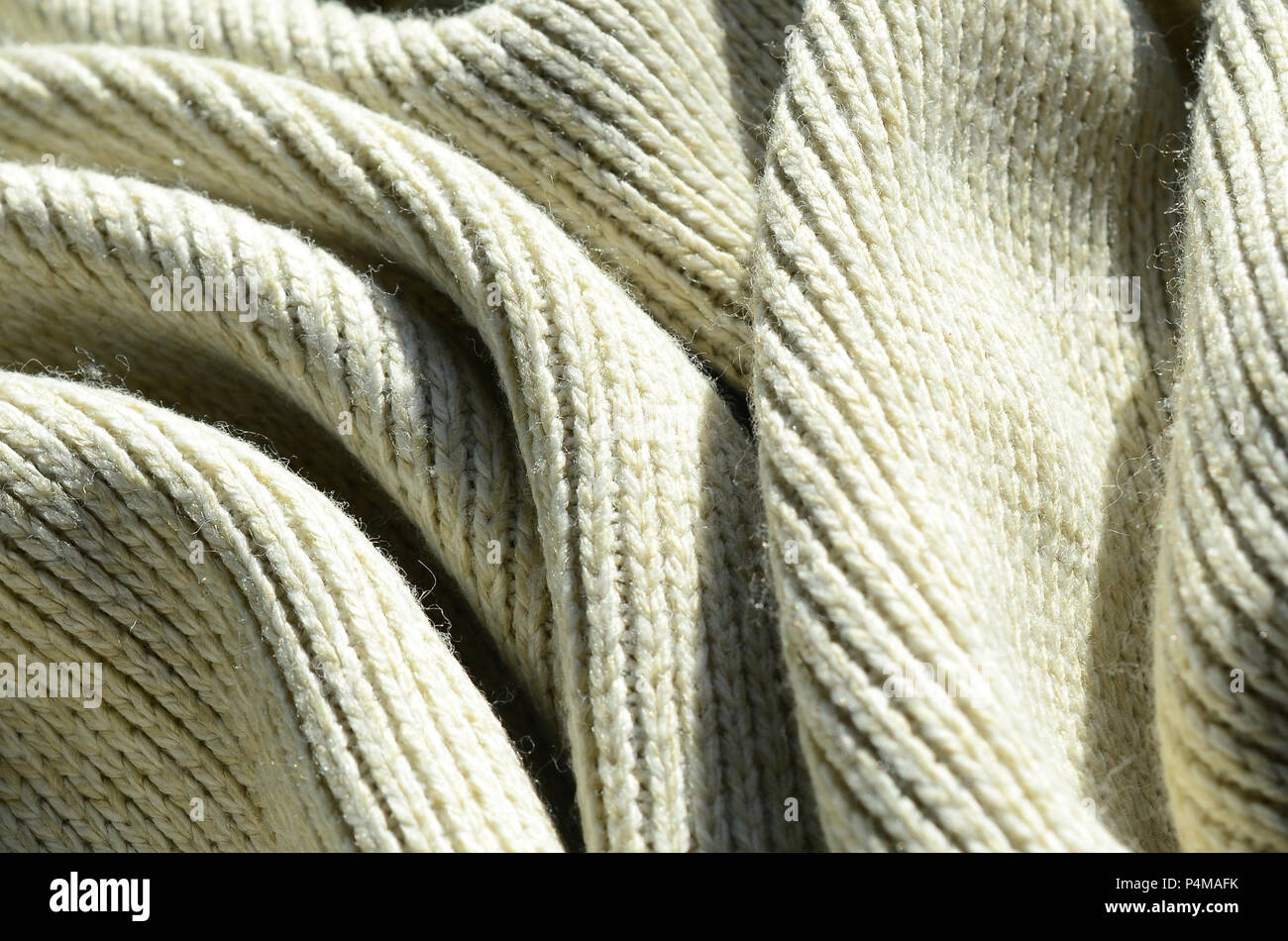 Fabric texture of a soft yellow knitted sweater. Macro image of the ...