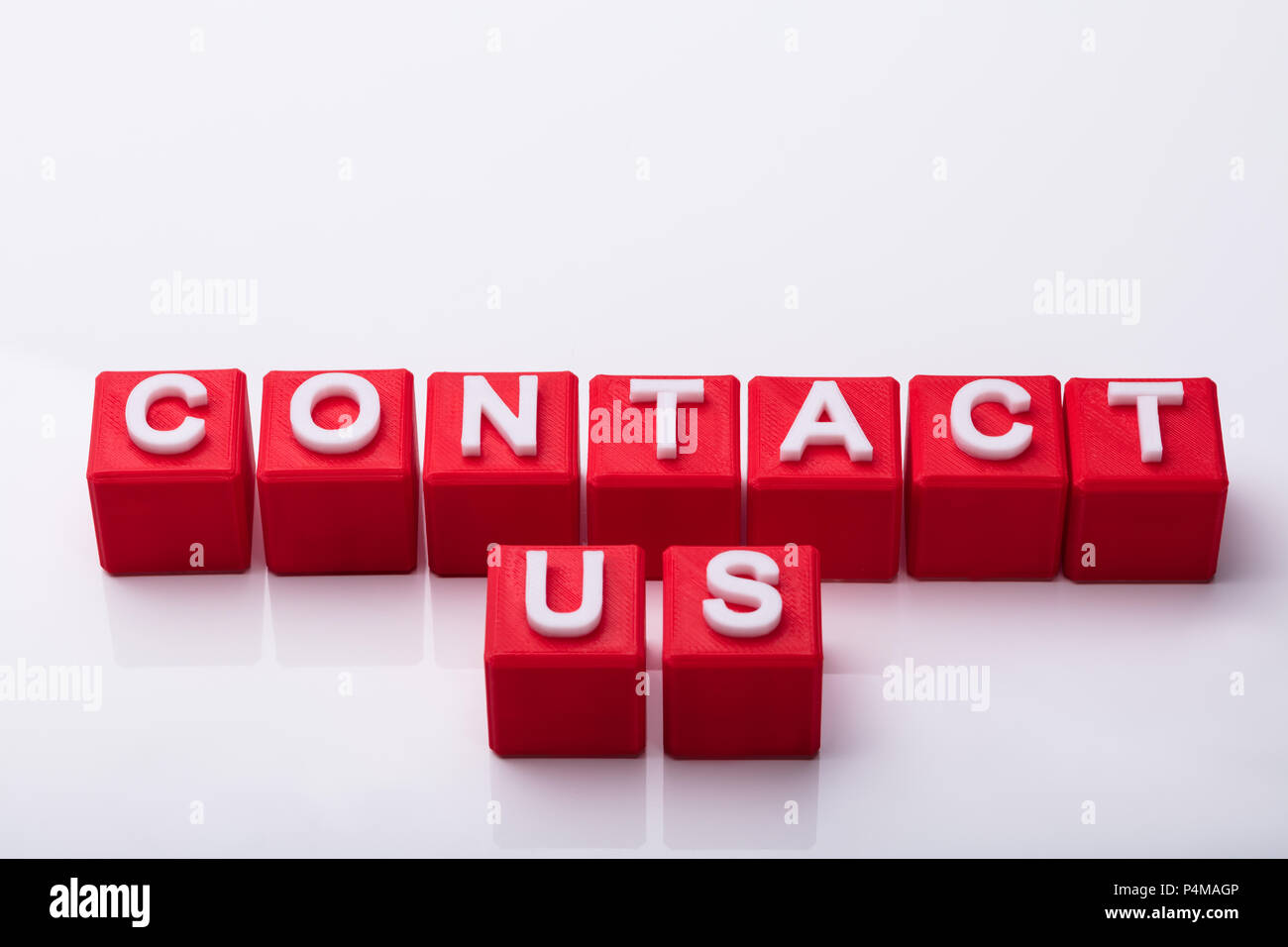 Elevated View Of Red Cubes With Contact Us Text On White Background ...