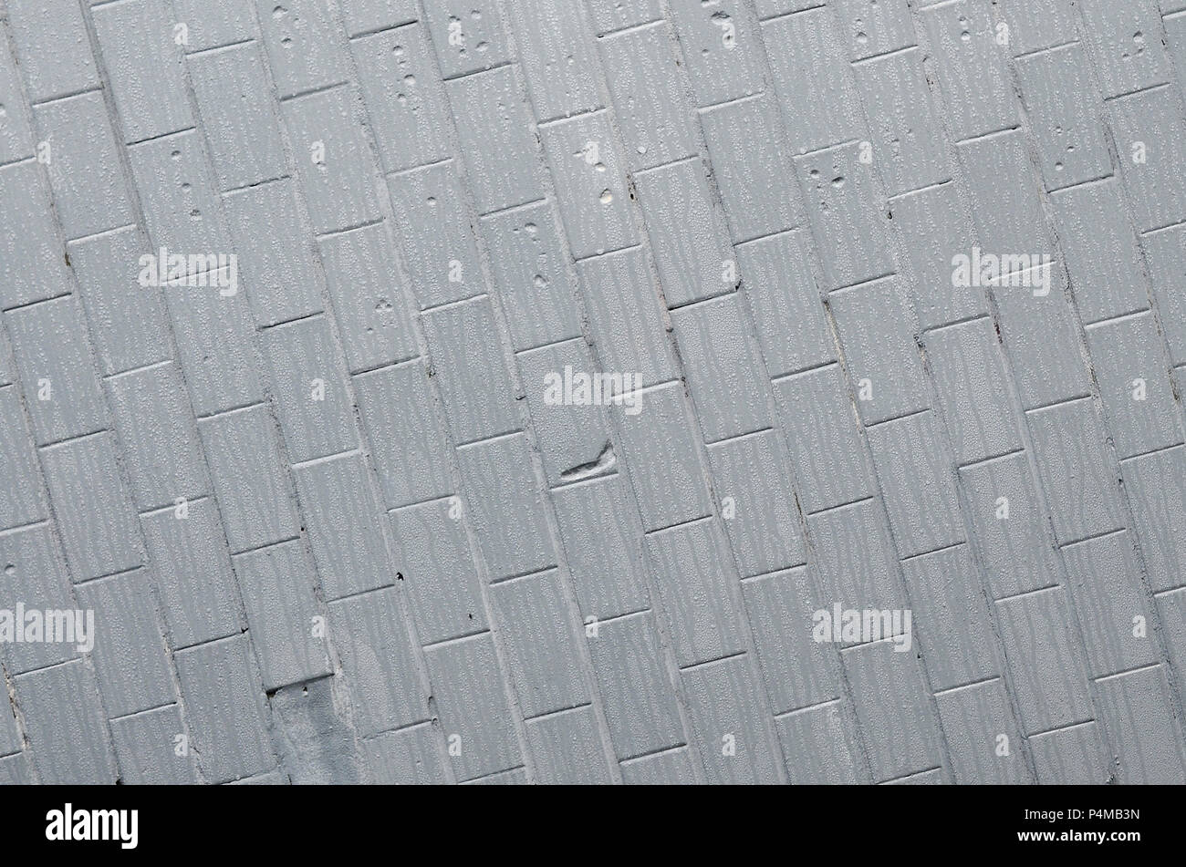 The texture of the wall from the old tile, painted gray under the ...