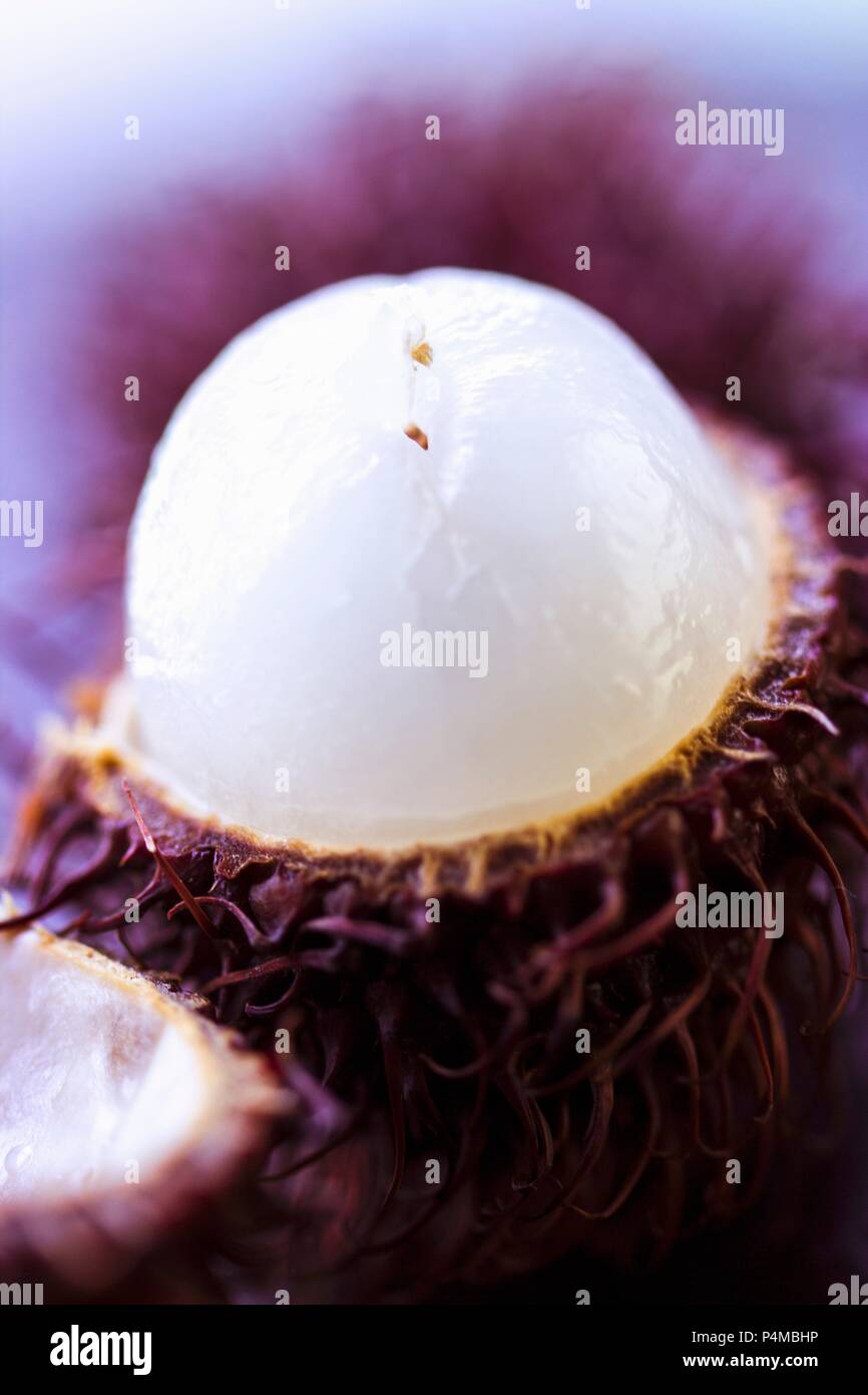 A close-up of an opened rambutan Stock Photo - Alamy